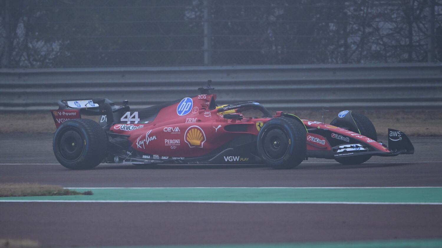 F1 champion Lewis Hamilton makes iconic first appearance in Ferrari red ...
