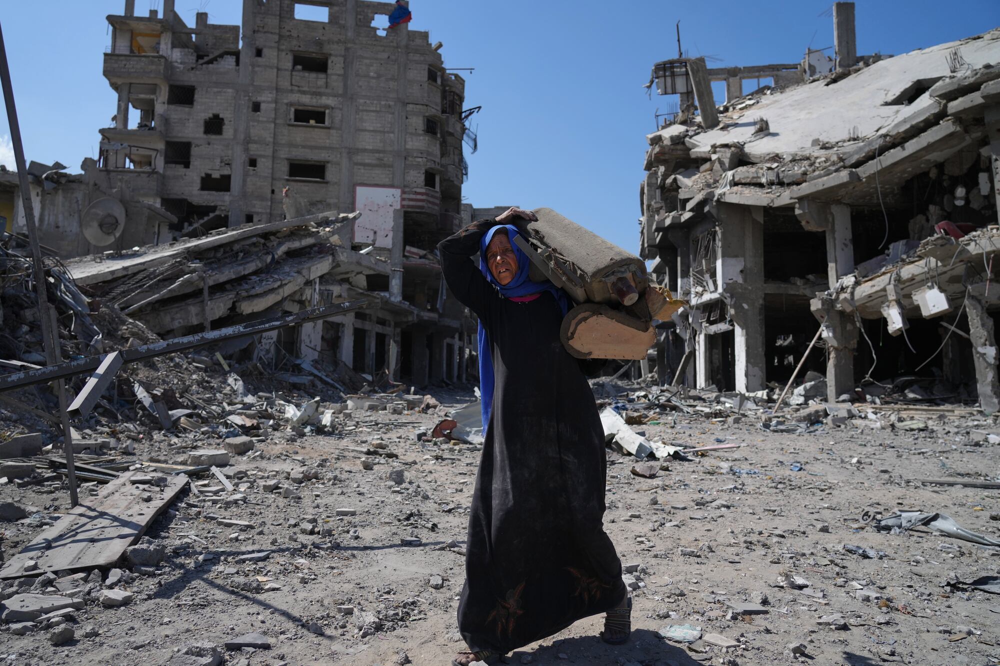 Displaced Palestinians begin return to war-ravaged Gaza with Israel ...