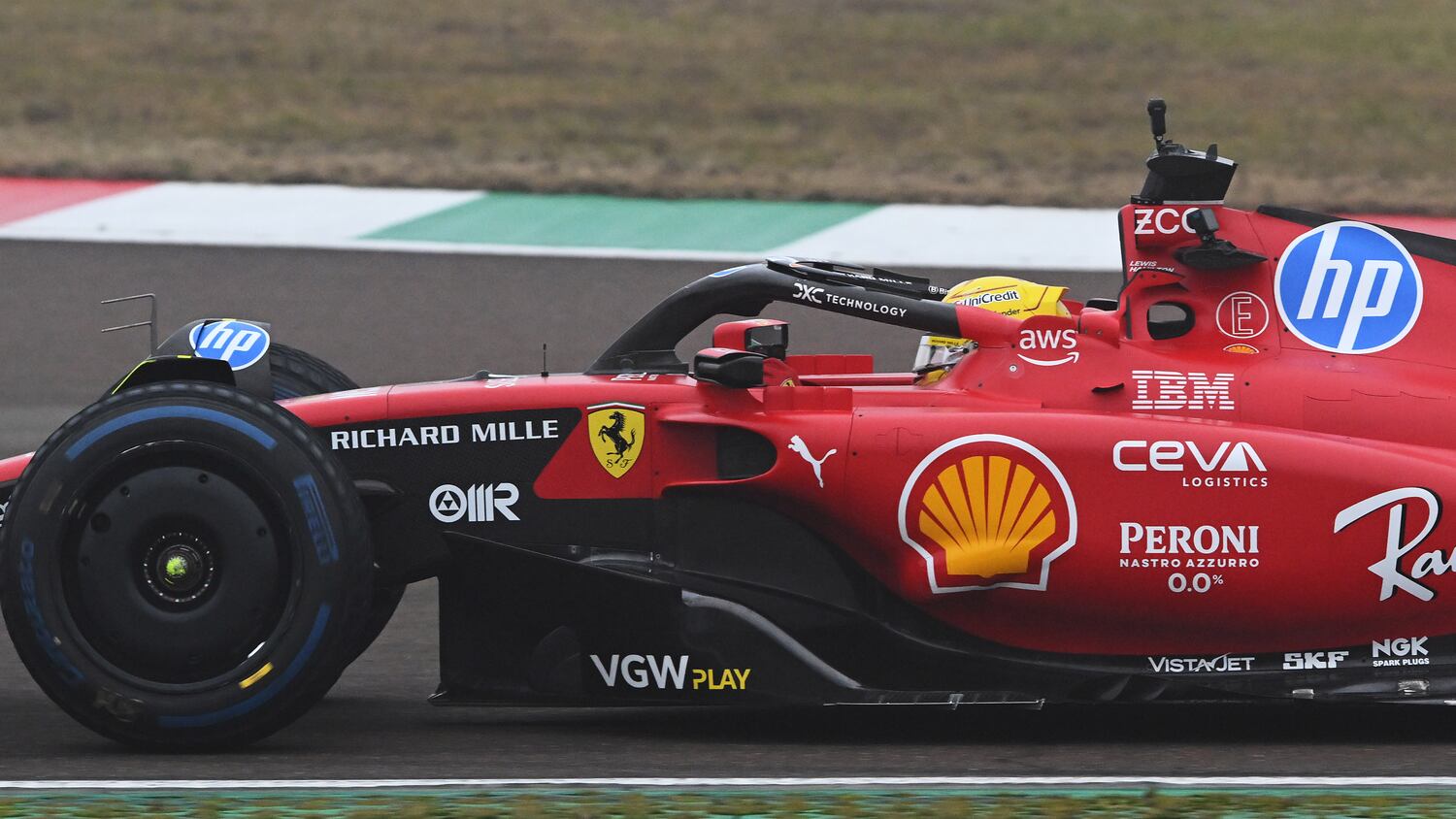 F1 champion Lewis Hamilton makes iconic first appearance in Ferrari red ...