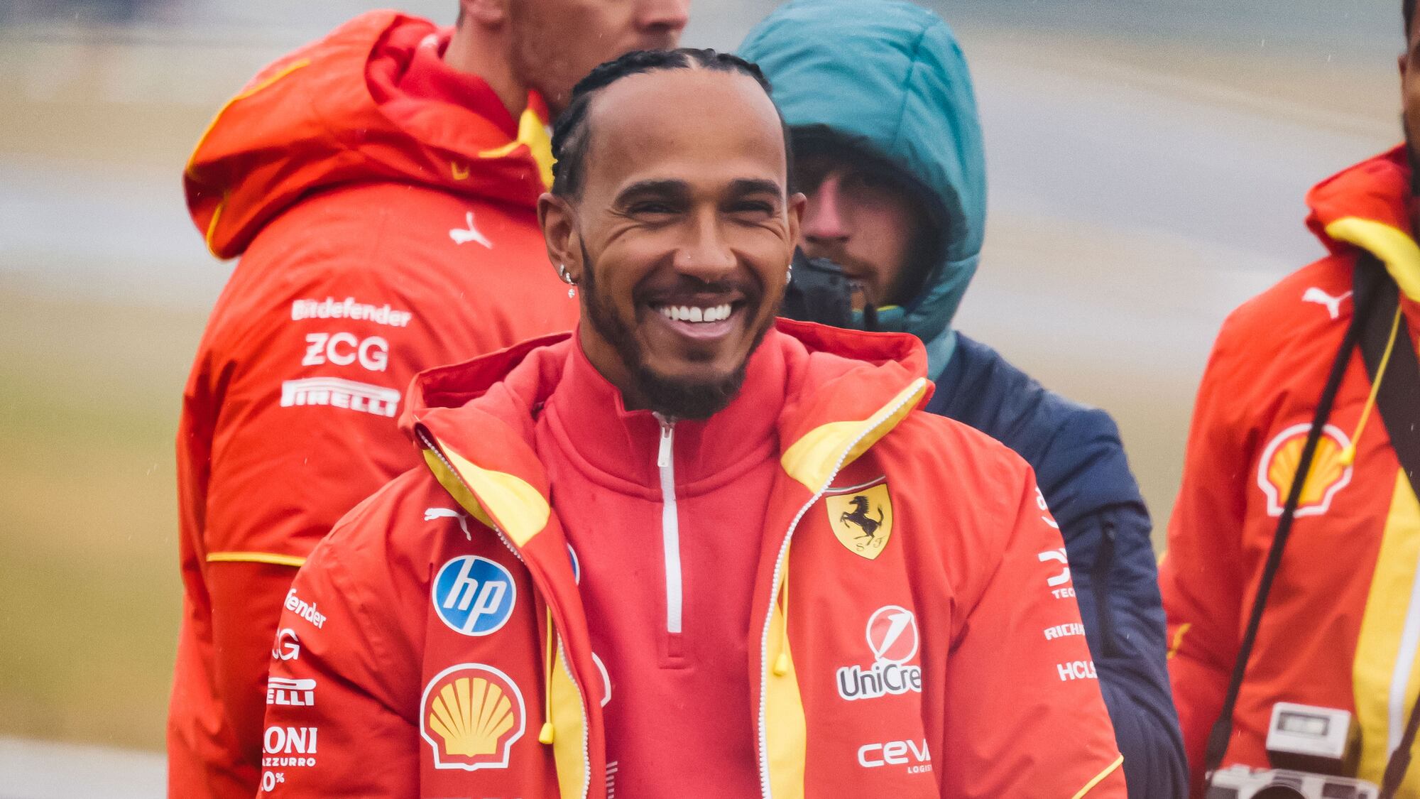 F1 champion Lewis Hamilton makes iconic first appearance in Ferrari red ...